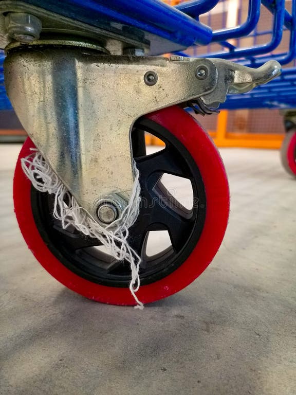 Red Trolley Wheel with Thread Stuck in Thmd Warehousing Area Stock ...