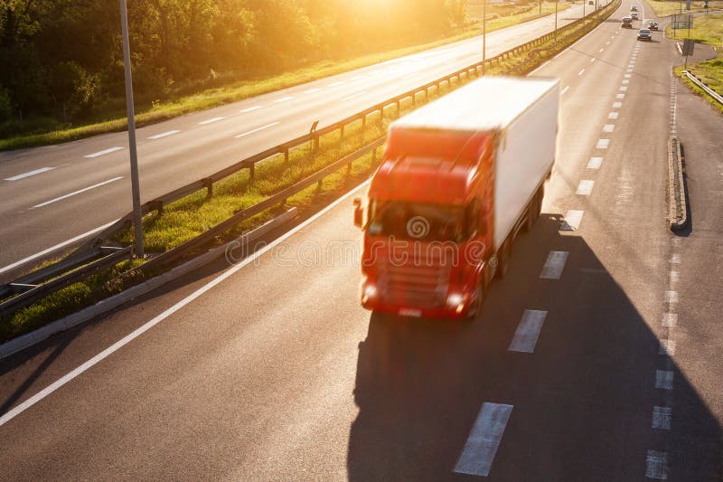 Red Truck in Back Light on the Highway Stock Image - Image of asphalt ...