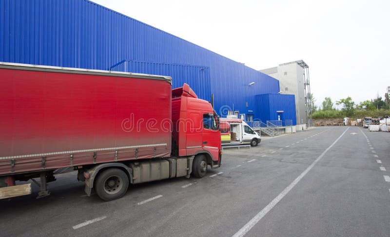 Red Truck Discharging Goods in Warehouse Stock Image - Image of lorry ...