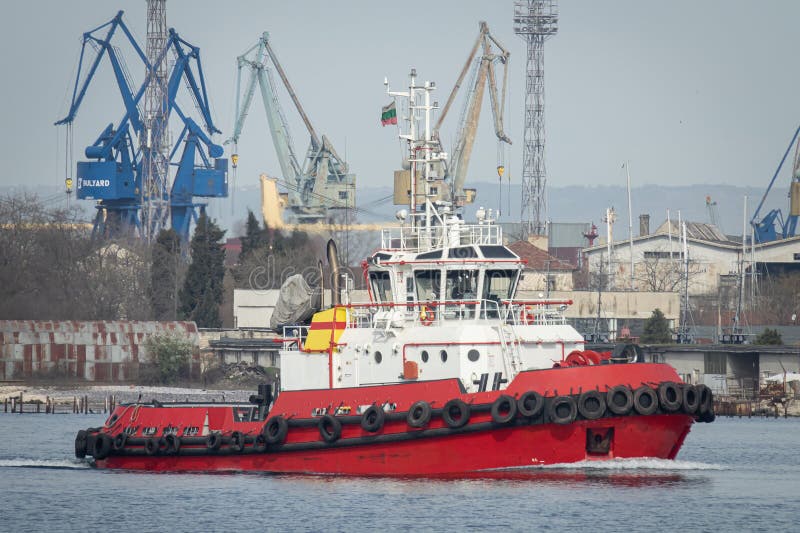 Red tug boat in the port stock photo. Image of metal - 287113810