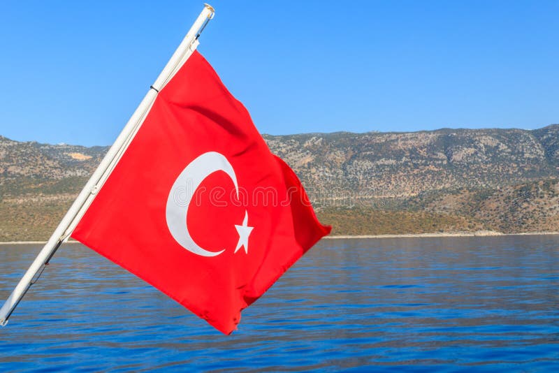 Red Turkish Flag Waving Over the Mediterranean Sea, Turkey Stock Photo ...