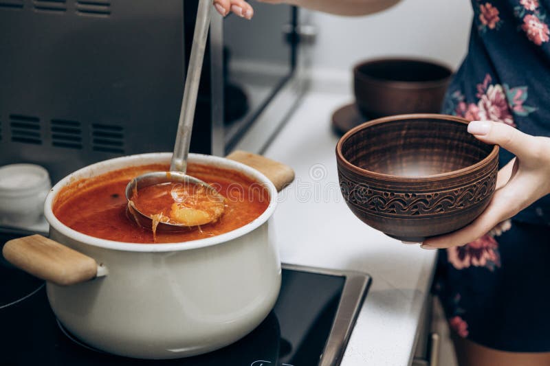 Red Ukrainian Borscht on the Table. Cooking the National First Course ...