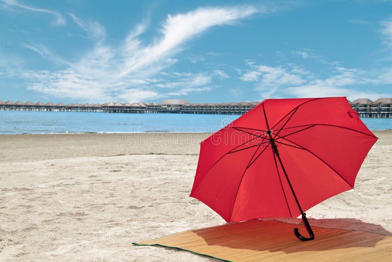Red Umbrella and Bamboo Mat on the Beach Stock Image - Image of ...