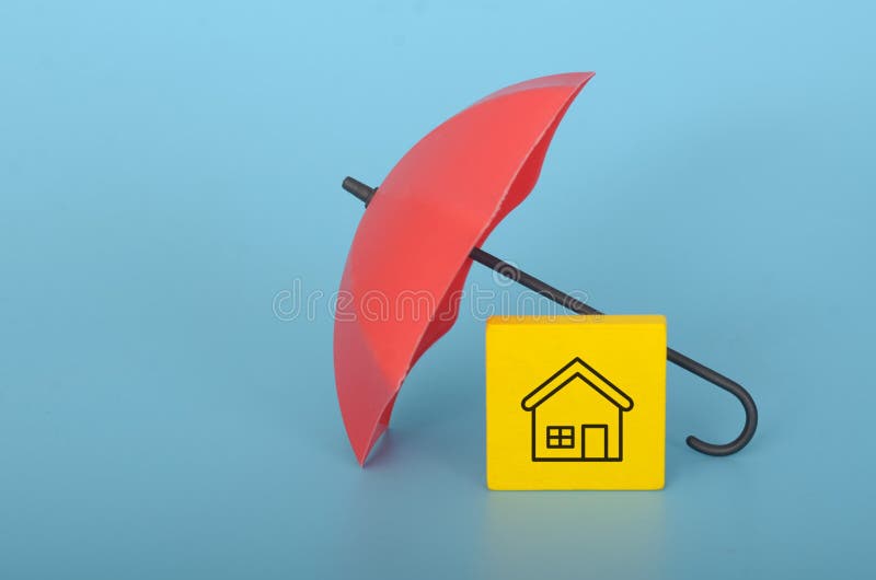 Red Umbrella Leaning on Yellow Block: Symbol of Home Protection and ...