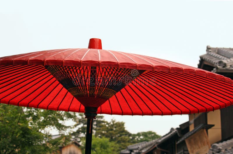Red Umbrella Surrounded by Trees and a Building during Daytime Stock ...