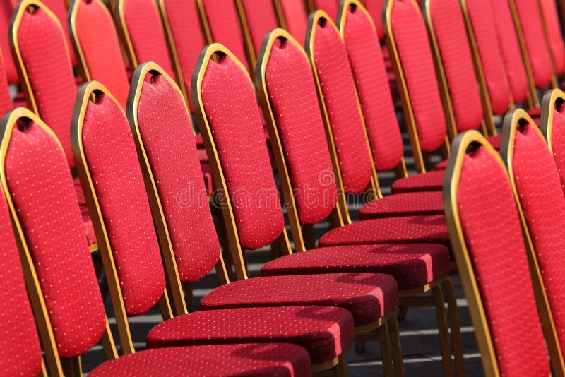 Red upholstered chairs stock image. Image of focus, audience - 158947201