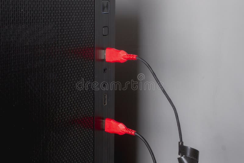 The Red USB Cord is Inserted into the USB Port of the Computer Stock ...