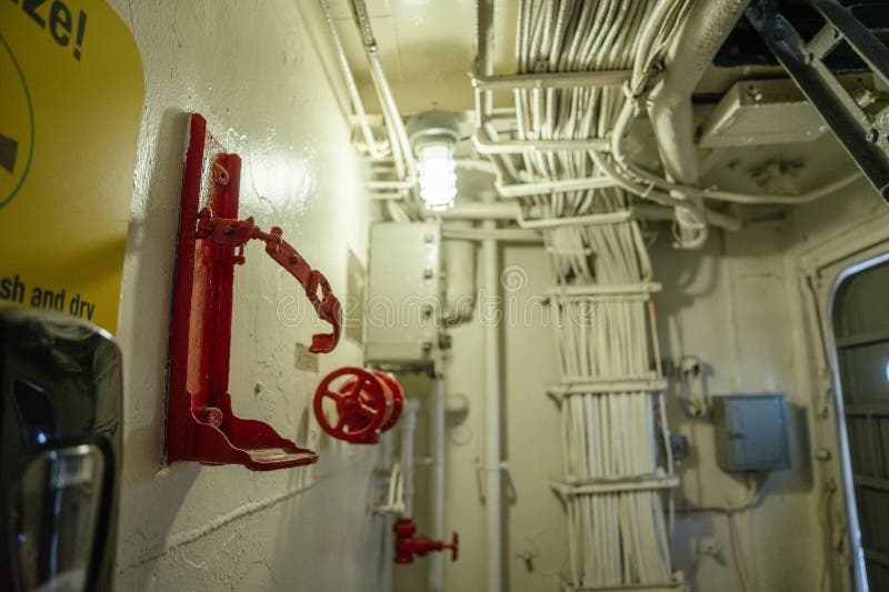 Red Valve and Cable Conduits Inside a Ship Stock Photo - Image of ...