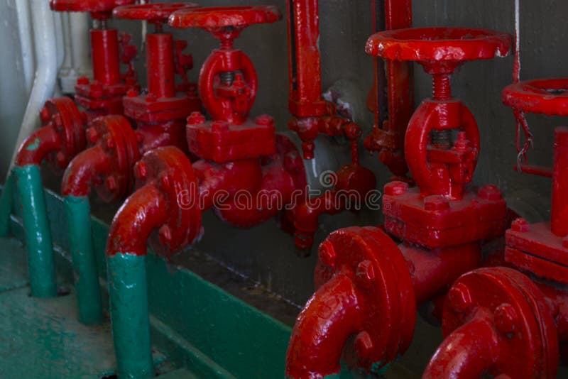 Red Valve on the Green Pipe. Valve with Wheel Handle Stock Image ...
