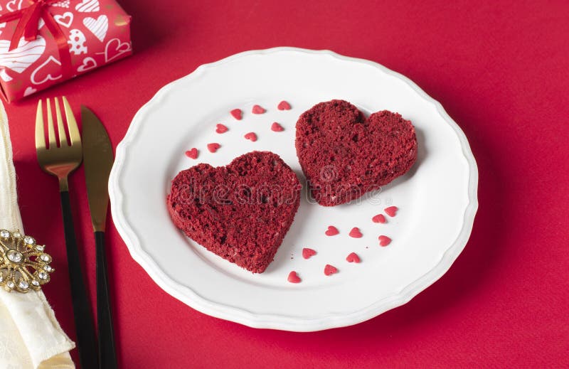Red Velvet Sponge Cakes in the Shape of Hearts on White Plate Stock ...