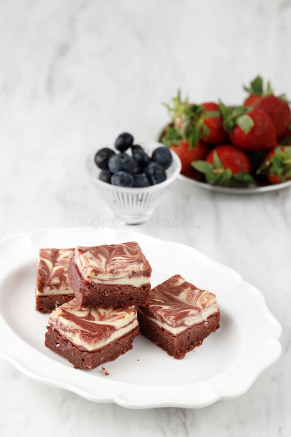 Red Velvet Squares in a Stack on a White Plate Stock Photo - Image of ...