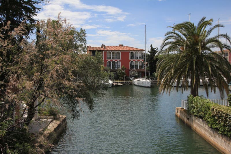 Red villa in a port stock photo. Image of river, channel - 276680156