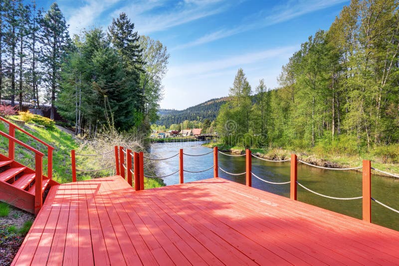 Red Walkout Deck with Staircase on River Bank Stock Image - Image of ...