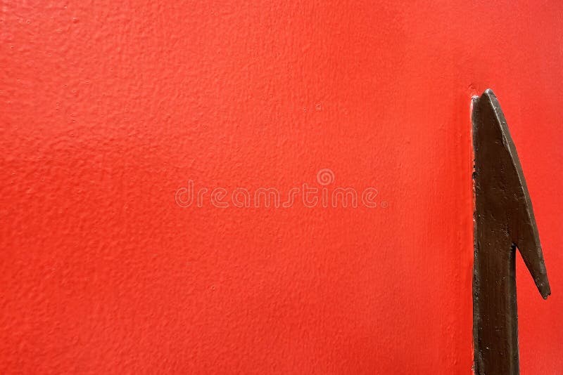 Red Wall with Metal Arrow Fence Background. Stock Image - Image of ...