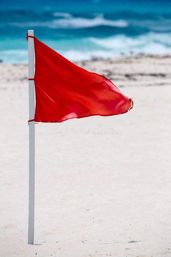 Red warning flag on beach stock photo. Image of access - 91813892