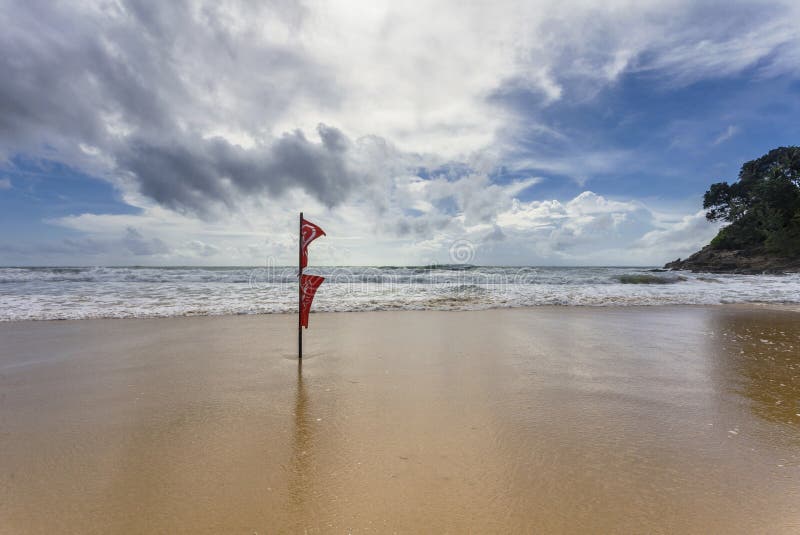 Red Warning Flag on Beach with Danger Sign Stock Image - Image of ocean ...