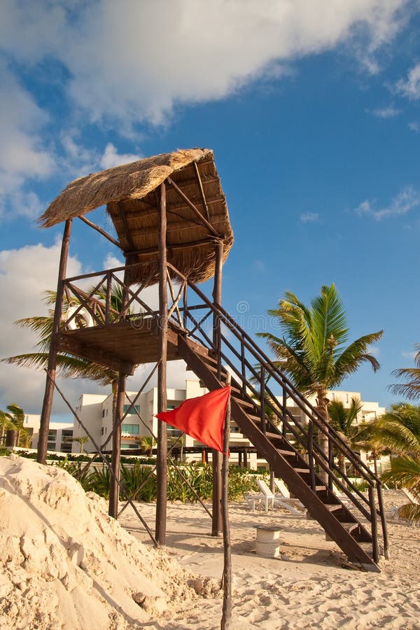 Red Warning Flag by Sandpile and Lifeguard Stand Stock Photo - Image of ...