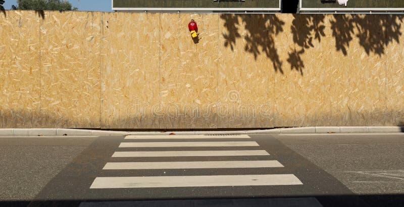 Red Warning Light on Oriented Strand Board Fence at the Roadside during ...