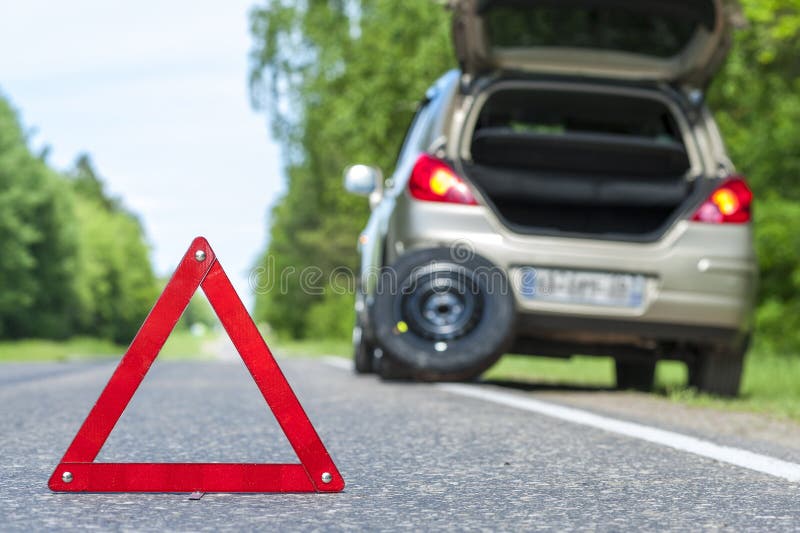 Red Warning Sign and Broken Car on the Roadside Stock Image - Image of ...