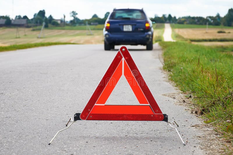 Red Warning Triangle and Broken Down Car Stock Photo - Image of ...