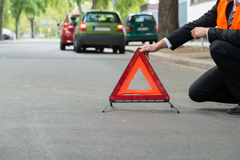 Red Warning Triangle with a Broken Down Cars Stock Photo - Image of ...