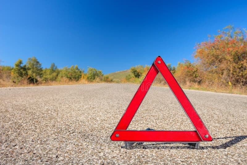 Red Warning Triangle on a Road Stock Image - Image of plastic ...