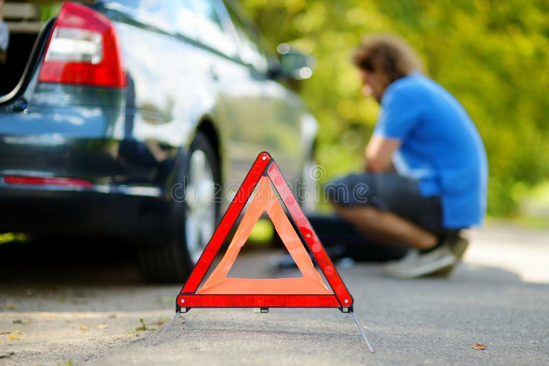 Red Warning Triangle Sign on the Road Stock Image - Image of automobile ...