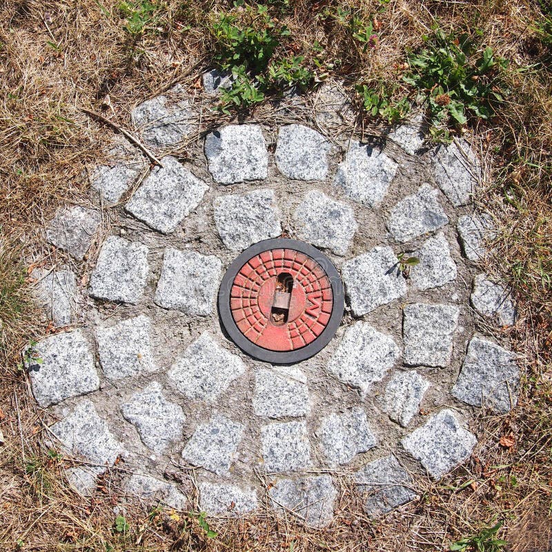 Red Water Cap on the Ground Stock Photo - Image of pavements, circle ...