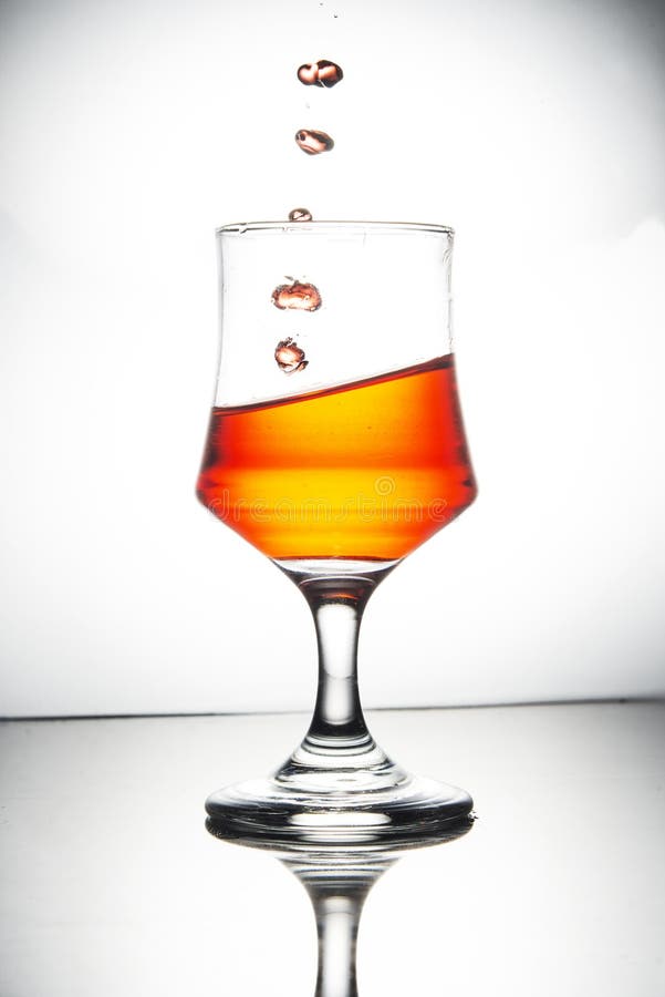 Red Water Drops Coming into Glass on White - Balance Concept Stock ...