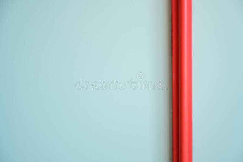Red Water Pipe on Light Blue Wall, Construction Industry Stock Photo ...
