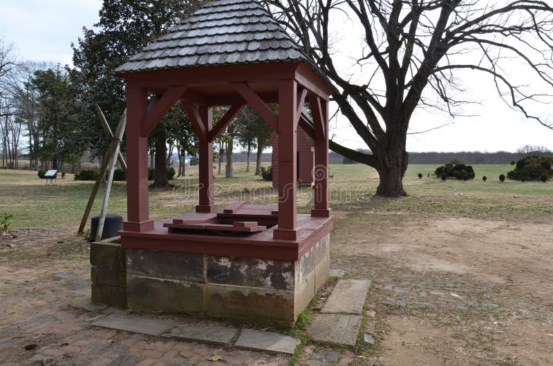 Red Water Well and Bricks and Trees and Grass Stock Photo - Image of ...