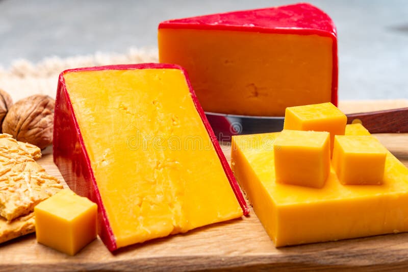 Red Waxed Yellow Cheddar Cheese and Crackers with Grated Cheese Stock ...