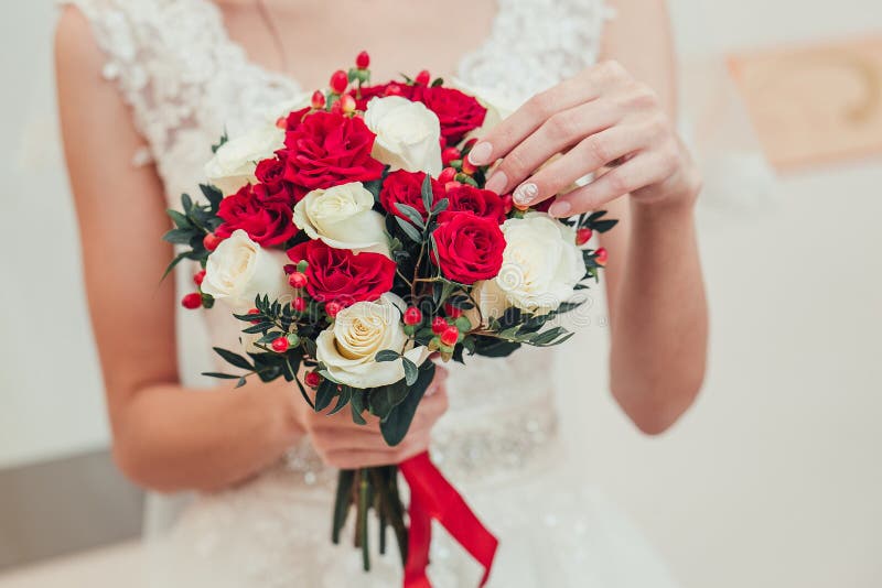 Red Wedding Bouquet in Hands of Bride Closeup Stock Photo - Image of ...