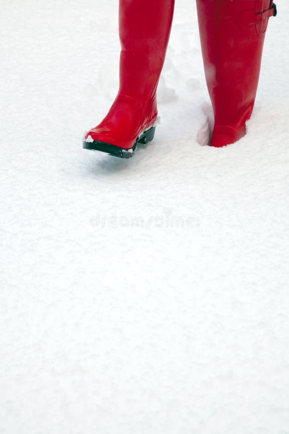 Red wellies in the snow stock image. Image of boots, winter - 11225703