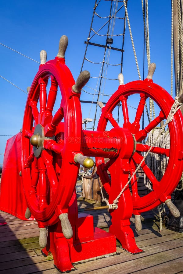 Red Wheel Helm on Antique Ship Stock Photo - Image of ship, sailing ...