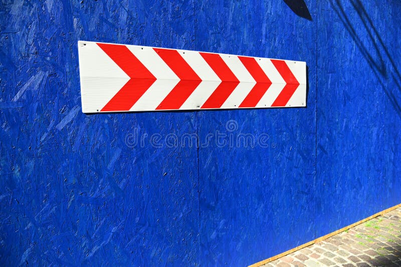Red on White Arrow Sign on Blue Surface Stock Photo - Image of design ...