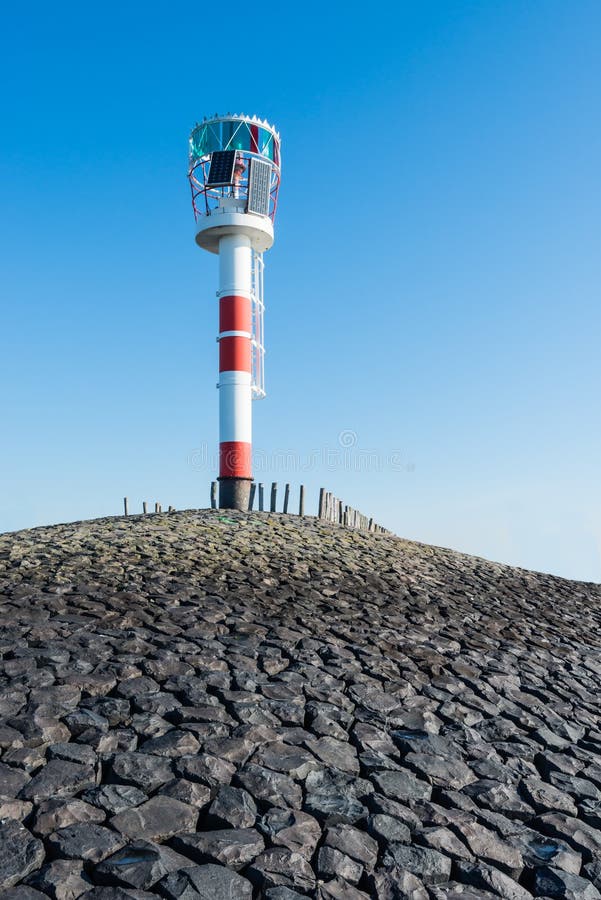 Red and White Beacon at the End of a Jetty Stock Image - Image of ...