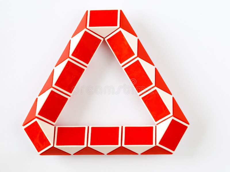 Red and White Magic Snake Twist Puzzle in Shape of Triangle Isolated ...