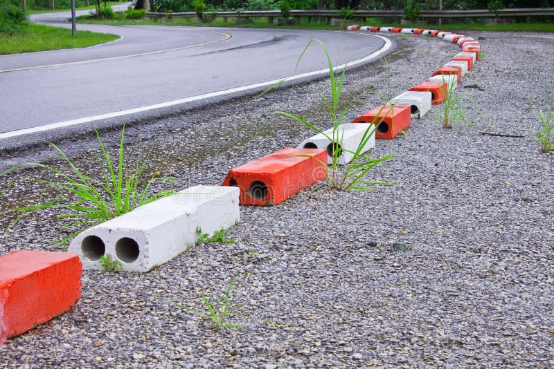 Red and White Block Prevent Danger at Roadside Stock Image - Image of ...
