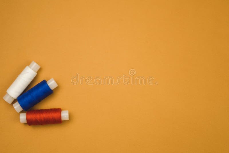Red White and Blue Threads on an Orange Background Stock Photo - Image ...