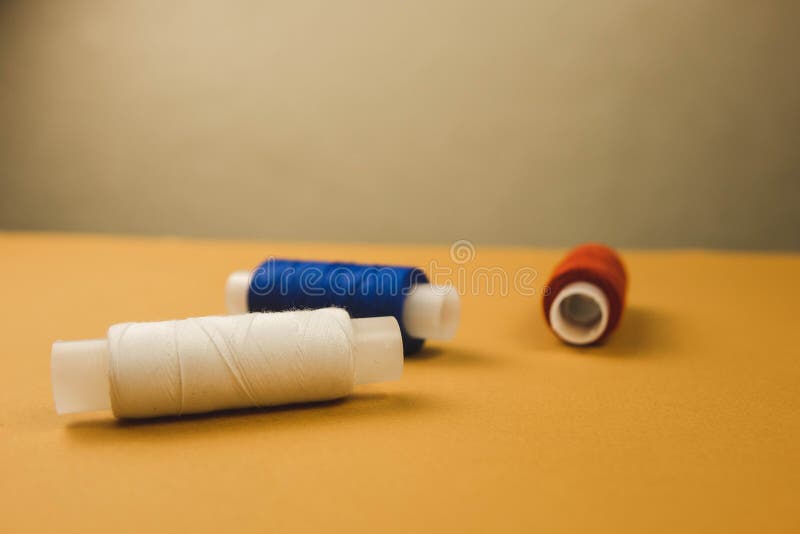Red White and Blue Threads on an Orange Background Stock Image - Image ...