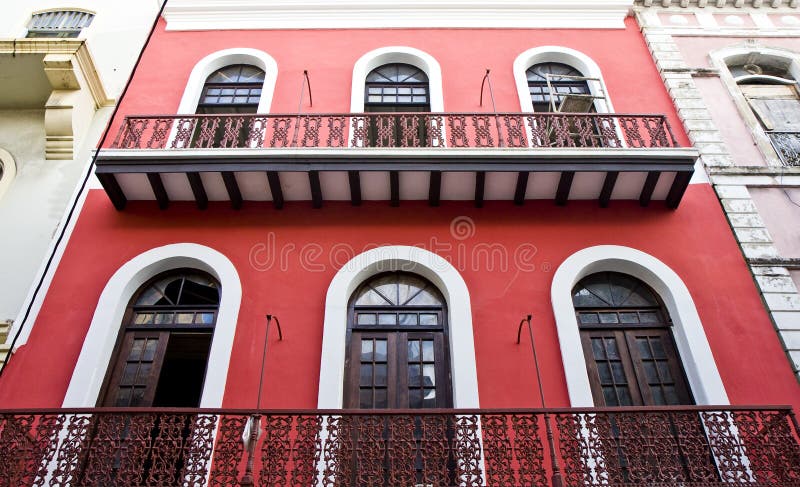 Red and White Building with Red Iron Railing Stock Photo - Image of ...