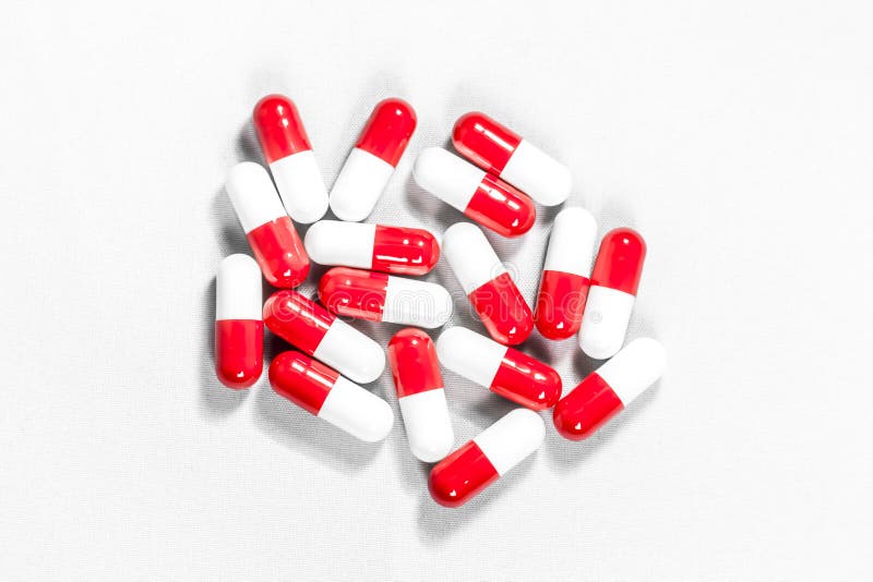 Red and white pills stock image. Image of dosage, medication - 104551563