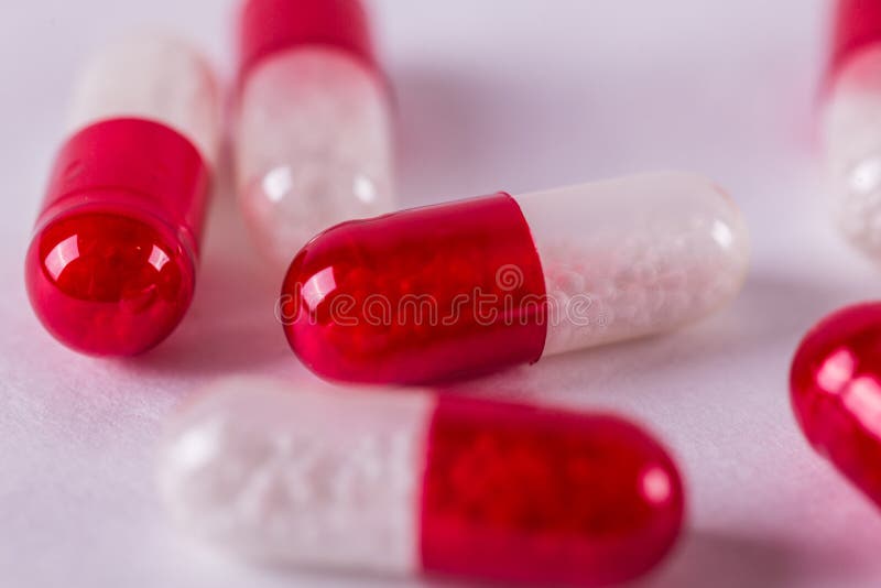 Red-white Capsules on a White Background Stock Image - Image of ...