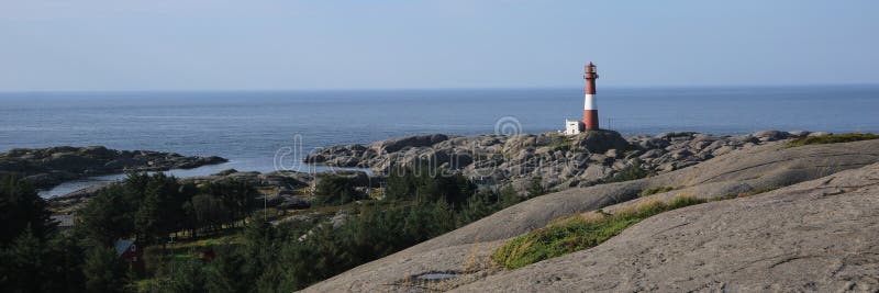 Lighthouse on the Rock Against the Sky Stock Photo - Image of ...