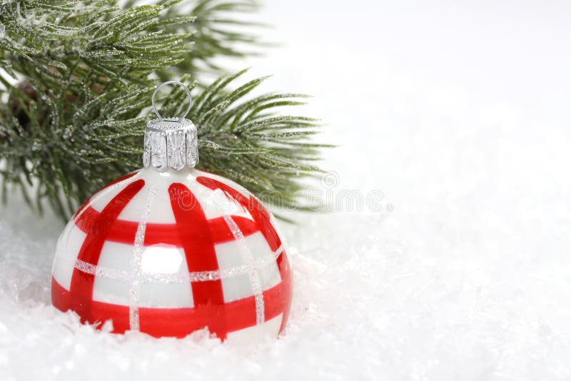 Red and White Christmas Balls on Snow and Icing Pine Branch Stock Image ...