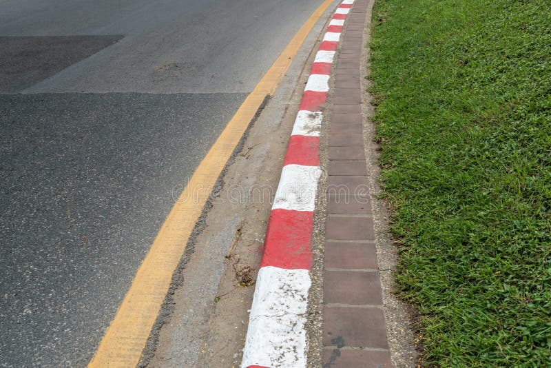 Red and White Concrete Road Curb Stock Photo - Image of pattern, grass ...