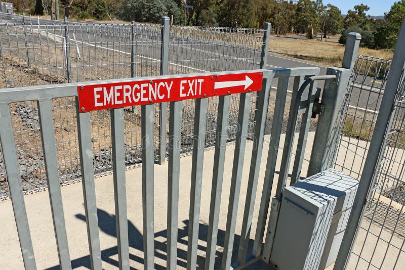 Red and White Emergency Exit Sign with Arrow Stock Photo - Image of ...