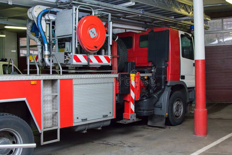 Red-white Fire Truck in the Garage Stock Photo - Image of gear, truck ...