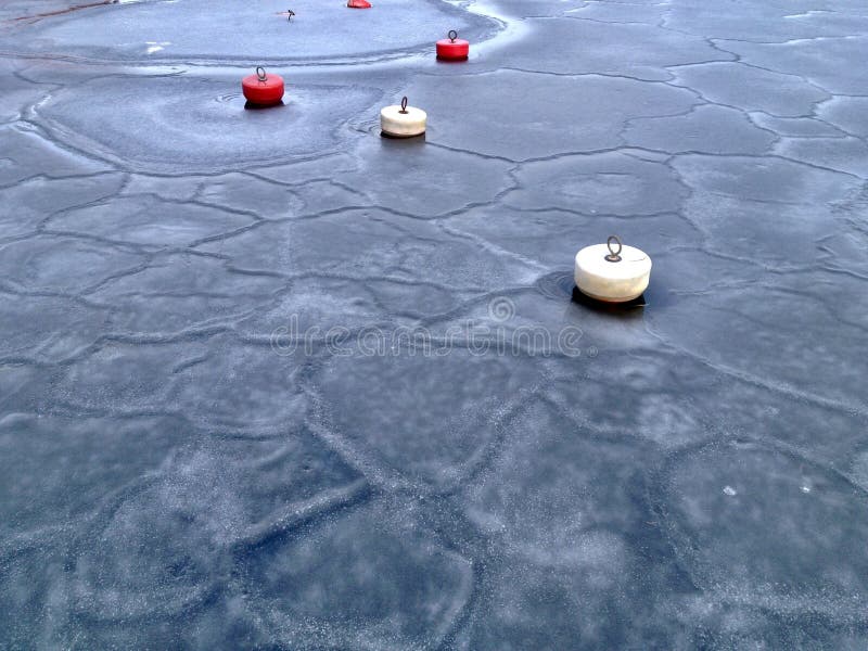 Red and White Floats on Frozen Water Kristiansand, Norway. Stock Photo ...